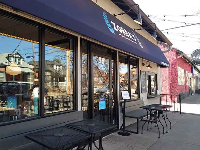 That blue awning beckons like a lighthouse guiding hungry sailors to breakfast paradise on a Denver morning.
