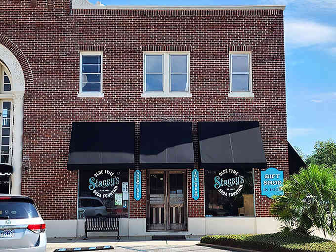 That brick facade with the black awnings is your portal to a sweeter, simpler time in Foley.