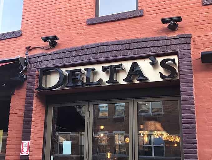 That brick facade and bold signage promise Southern comfort just beyond those doors, and they deliver spectacularly.