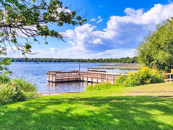 That perfect stretch of green lawn meeting blue water, where picnic blankets and lake breezes create summer magic.