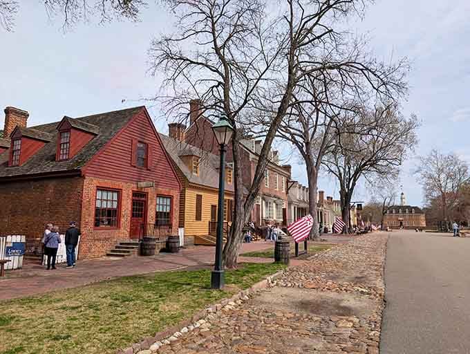 Brick sidewalks and weathered trees frame a street where tricorn hats outnumber baseball caps on any given afternoon.