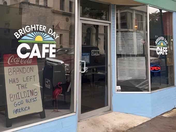 That cheerful blue exterior and vintage Coca-Cola sign are your first clue that something special awaits inside.