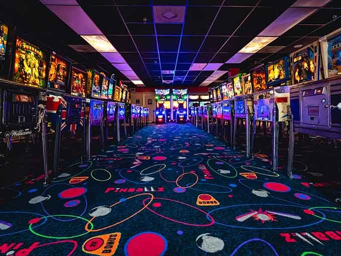 Rows of pinball machines stretching into the distance like a neon-lit highway to happiness and high scores.