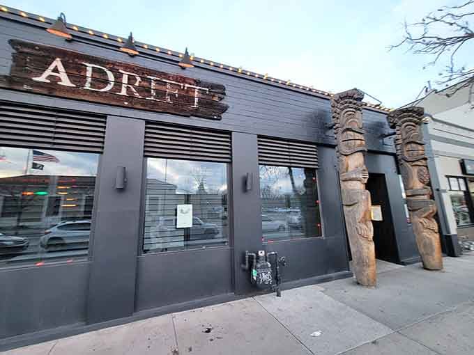 Those tiki guardians aren't just for show; they're your first hint that reality ends at this doorstep.