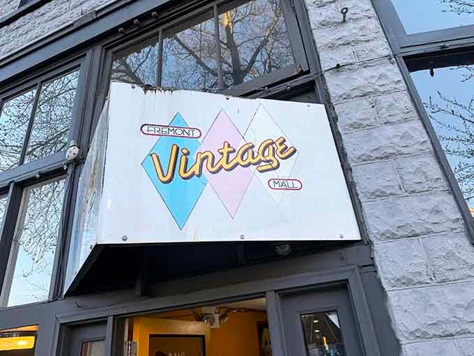 That cheerful sign beckons you inside like a friendly wave from a more colorful era.