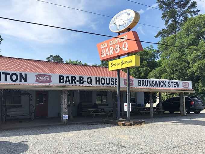 That vintage sign and weathered wood exterior promise the kind of authentic barbecue that's worth every single mile you drove.