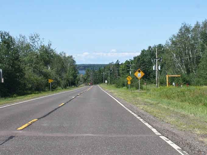 The open road beckons with promises of adventure, fall colors, and Lake Superior views beyond compare.