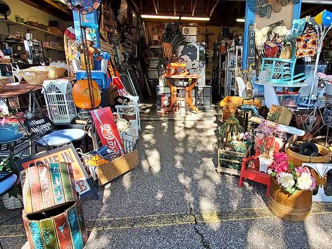 A vendor booth so packed with eclectic finds it looks like someone's attic exploded in spectacular fashion.