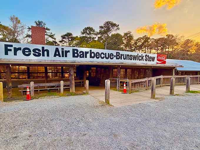 That golden sunset glow hitting Fresh Air Barbecue's sign isn't just pretty, it's practically a beacon for hungry souls.