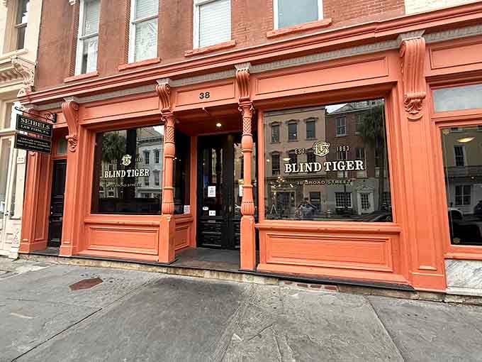 That coral-colored storefront isn't just pretty, it's basically a lighthouse guiding you to excellent cocktails and possible ghost encounters.