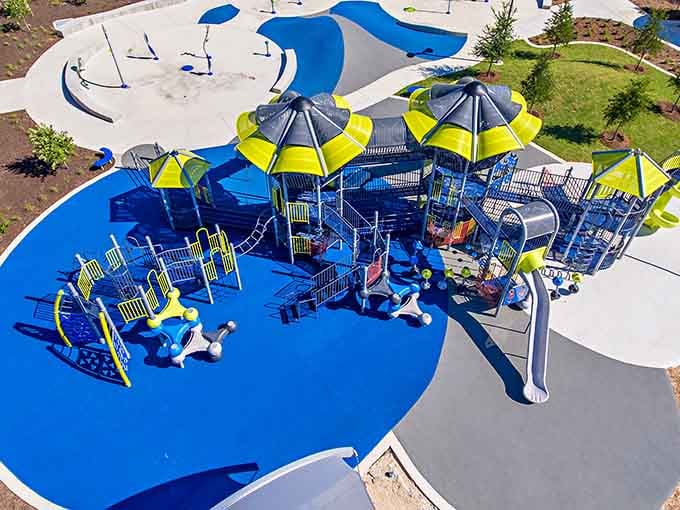 Bright blue surfaces and contemporary structures signal this isn't your grandfather's neighborhood park experience.