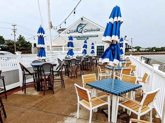 Those blue umbrellas aren't just pretty, they're your front-row seats to waterfront dining perfection.