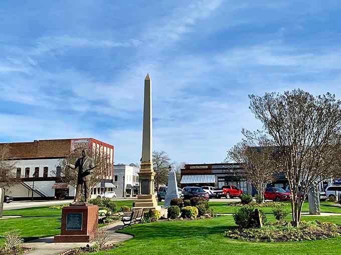 The town square where time slows down and Southern charm speeds up, complete with monument and manicured greenery.