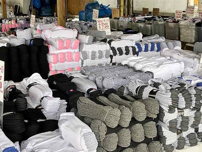 Sock mountains rise in organized chaos, offering enough pairs to keep your feet cozy through multiple Wisconsin winters.