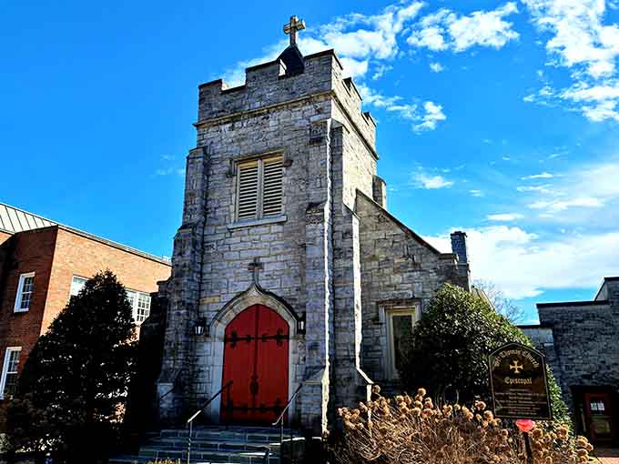 Weathered stone and that bold red door stand as testaments to faith and community enduring through generations.