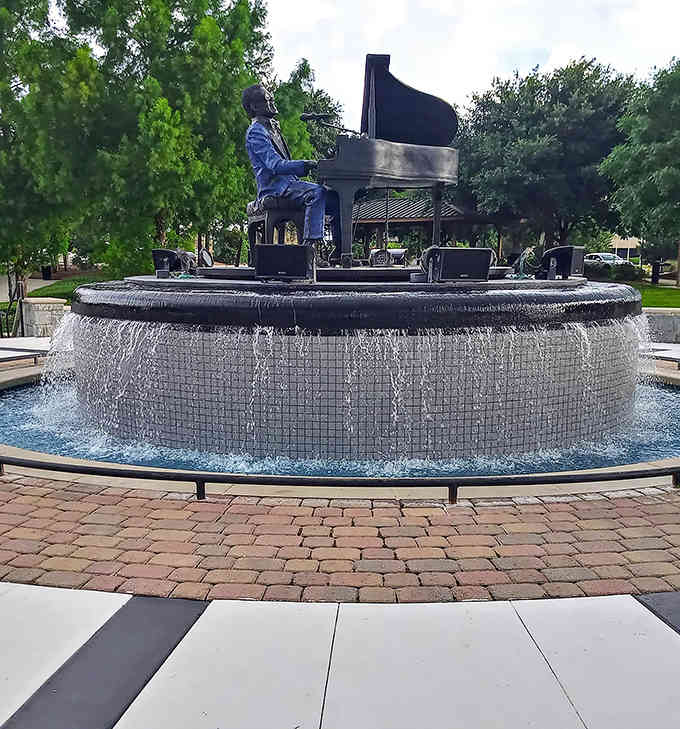 Ray Charles sits eternally at his piano, honoring Albany's most famous son in bronze and water.