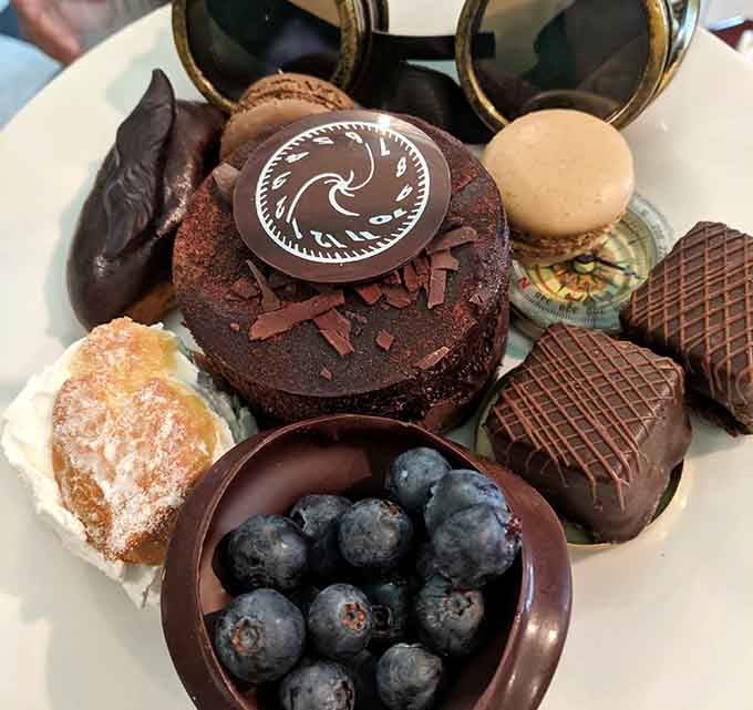 This dessert platter looks like the Mad Hatter raided a French patisserie and we're here for it.