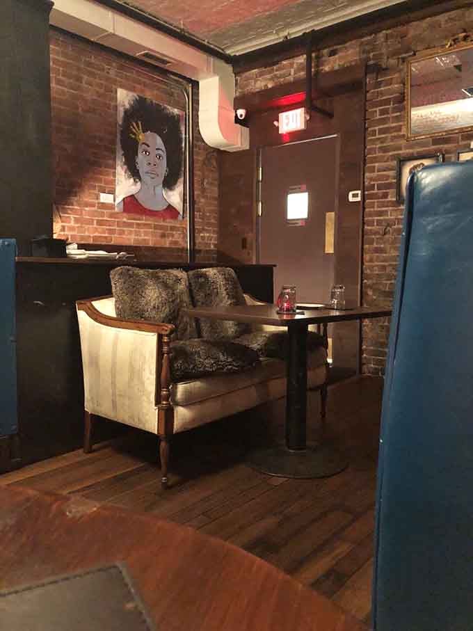 Vintage seating and portrait art transform dining into an experience that feels curated, not corporate.