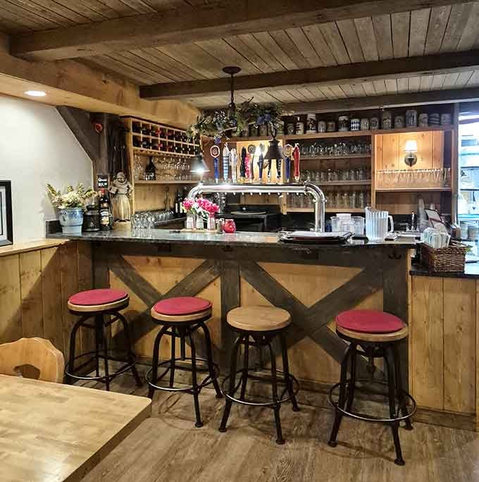 Beer taps, wooden beams, and bar stools ready for stories, this is where the gem&uuml;tlichkeit happens naturally.