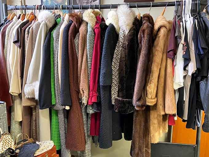 Vintage coats hanging like a timeline of fashion, when quality meant something and fast fashion hadn't been invented yet.