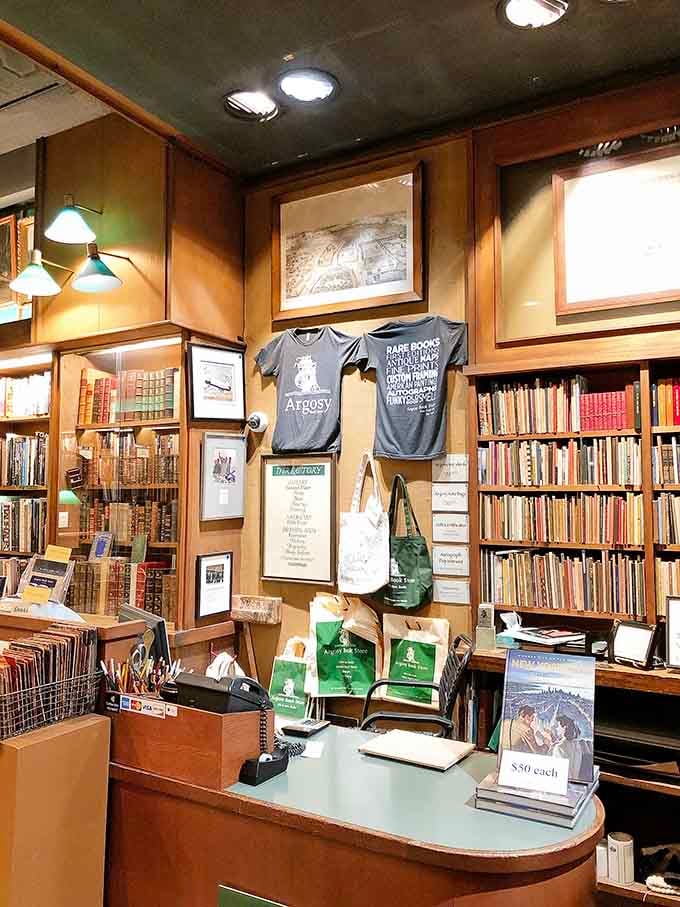The checkout counter displays merchandise and maps, proving this place sells culture, not just something to read on vacation.