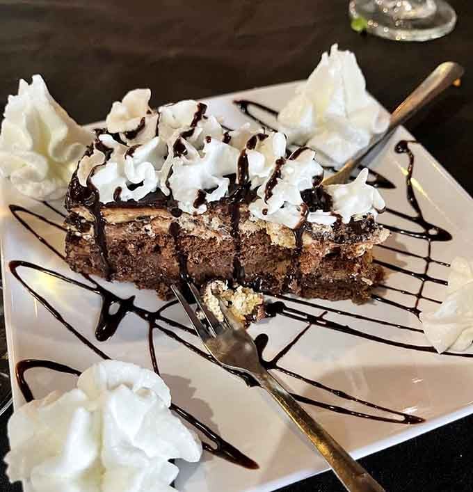 Chocolate cake piled high with whipped cream, because dessert for breakfast is called living your best life.