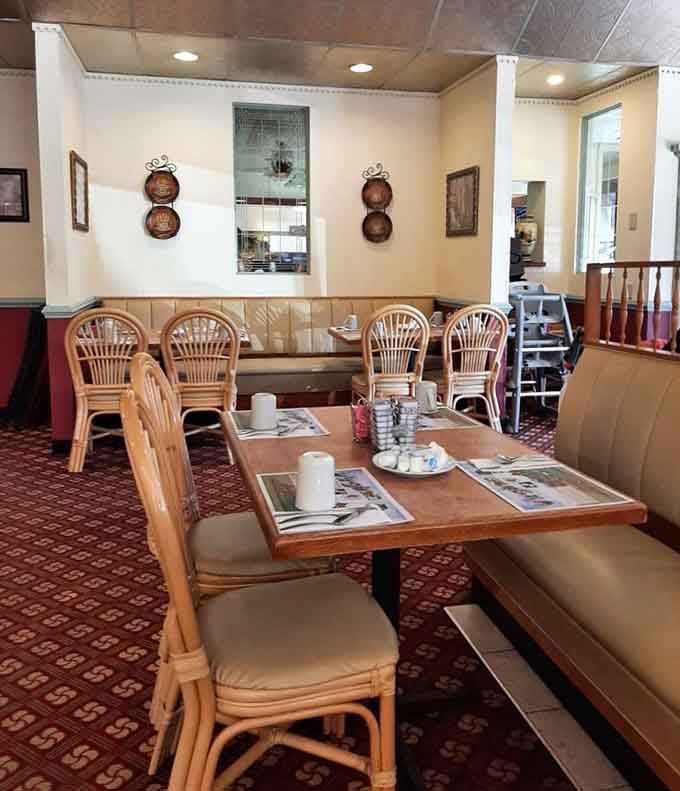 Booth seating where countless breakfast warriors have sat, strategized, and ultimately surrendered to the pancake stacks before them.