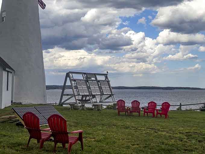Those red Adirondack chairs are basically saying "sit here, contemplate life, forget your email exists for five minutes."