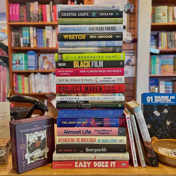 Colorful spines stacked high represent countless hours of reading pleasure waiting to be discovered and devoured.