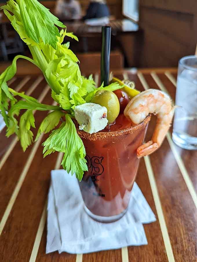 A Bloody Mary so loaded with garnishes it's practically a salad, a drink, and an appetizer having a party together.