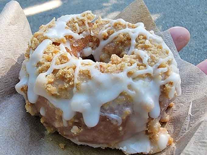 Cinnamon coffee cake doughnut proving that breakfast pastries can achieve levels of excellence previously thought impossible by mortals.