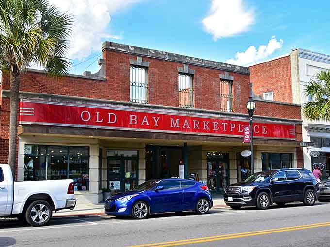 The Old Bay Marketplace sign beckons like a lighthouse guiding hungry travelers to shore and sustenance.