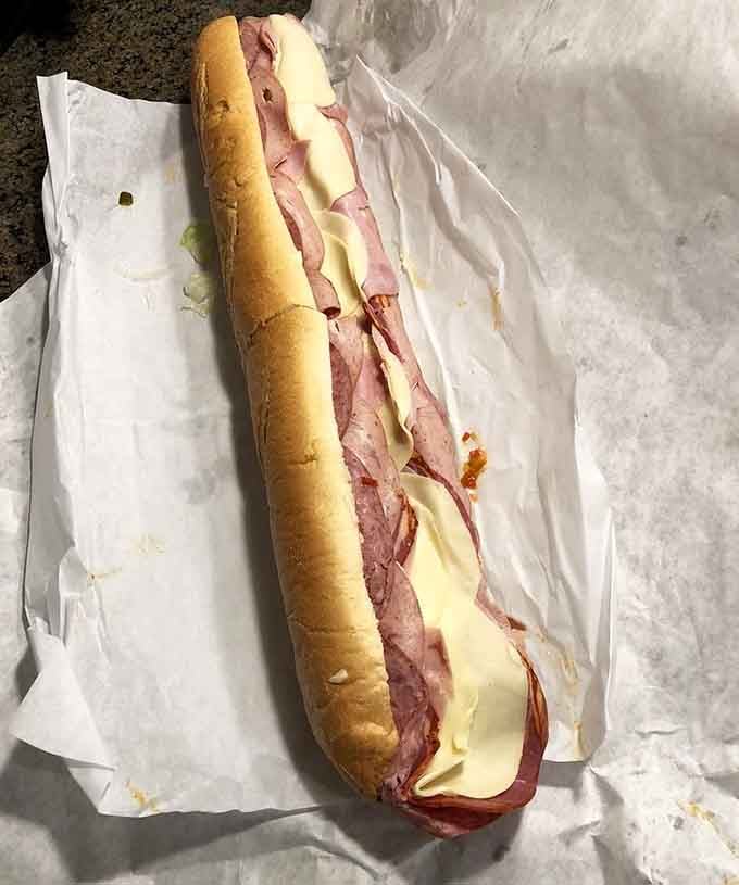 Behold the Marc Anthony in all its glory, a sandwich so large it deserves its own zip code.