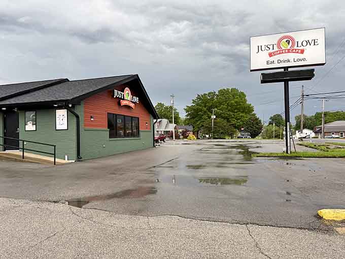 Just Love Coffee beckons with its colorful exterior, promising caffeine and community in equal measure.