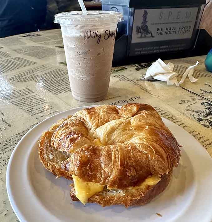 Flaky croissant sandwich paired with a shake, proving breakfast doesn't need to choose between savory and sweet.