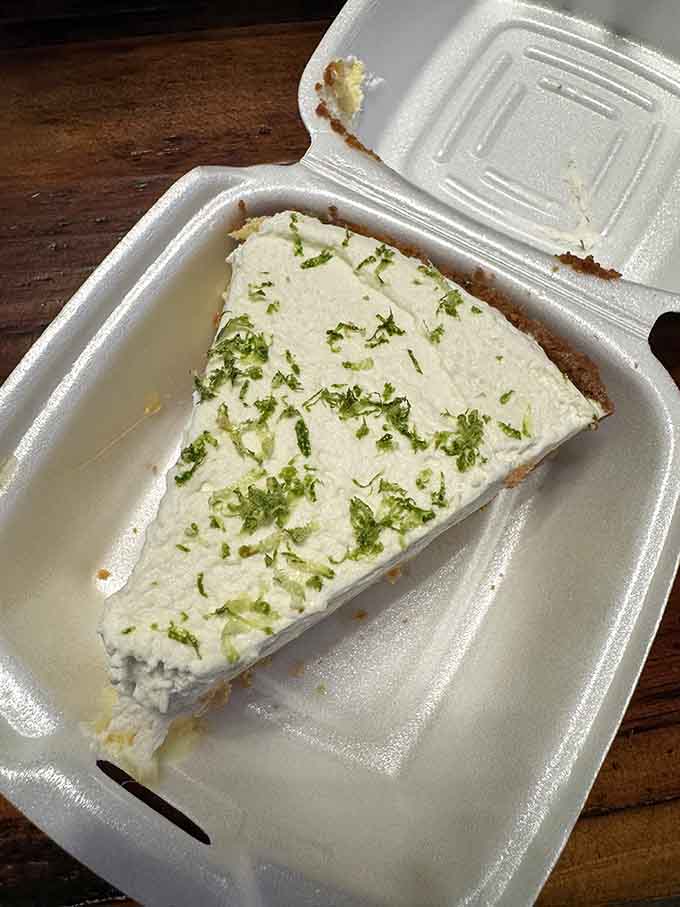 Creamy key lime pie topped with zesty green shavings, the refreshing finale your taste buds didn't know they needed.