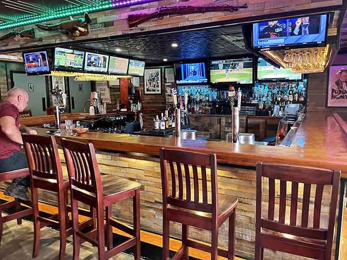 The well-stocked bar and rustic wood paneling create an inviting space for pre-dinner drinks.