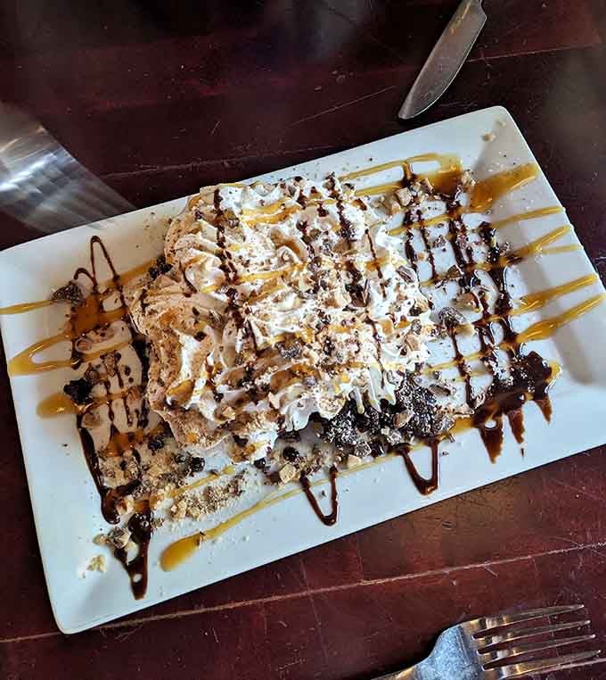 The Wave of Passion Chocolate Cake arrives looking like dessert decided to throw itself a party on your plate.