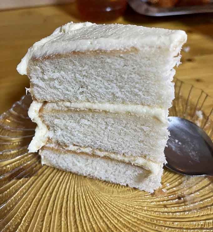 Layers of amaretto cake so tall they defy gravity and common sense, in the very best way possible.