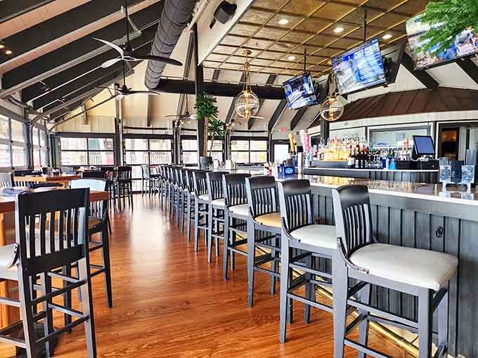 Vaulted ceilings and waterfront windows turn casual dining into something that feels almost resort-like without the pretension.