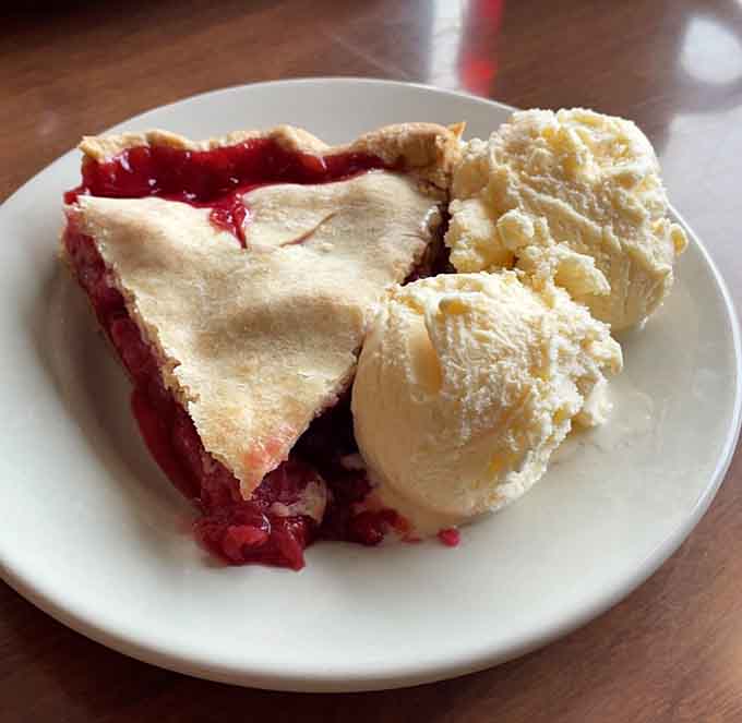 Cherry pie with vanilla ice cream melting into the filling, the kind of dessert that makes everything right.