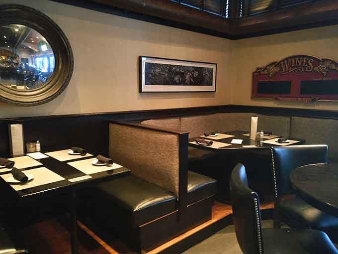 Cozy booth seating with nautical touches creates intimate spaces perfect for conversations that don't involve shouting over noise.