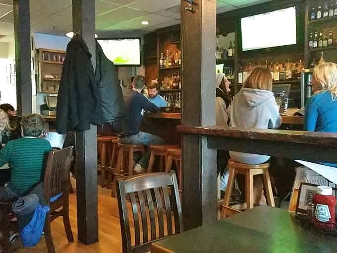The bar buzzes with friendly energy as locals gather for good food and even better game-watching company.
