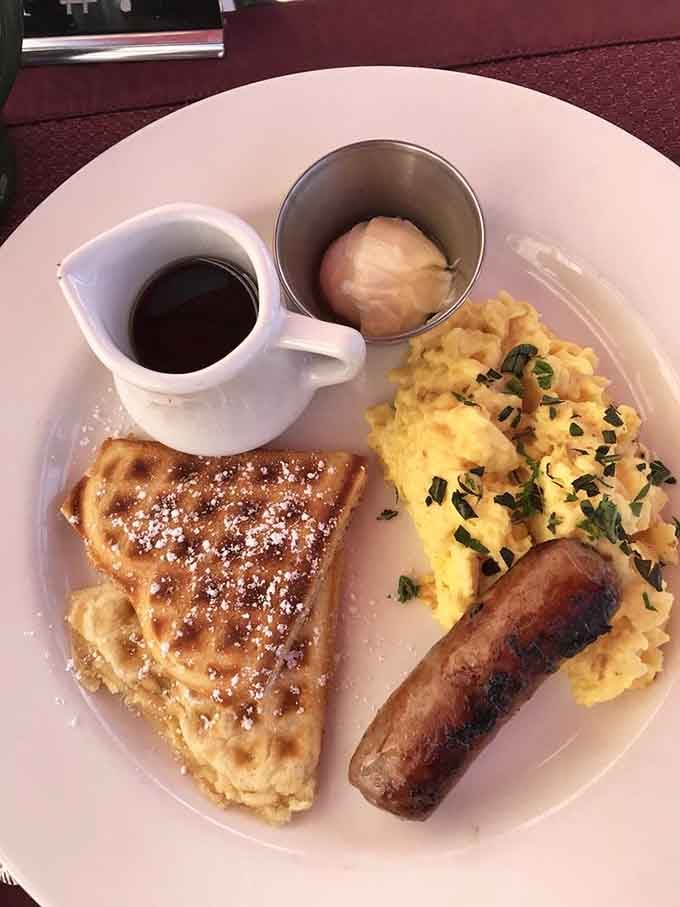 Breakfast featuring waffles, eggs, and sausage proves this mansion takes morning meals as seriously as dinner.