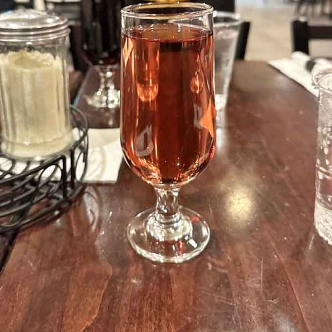 White Zinfandel catches the light beautifully, offering a sweet complement to your Italian feast in elegant simplicity.