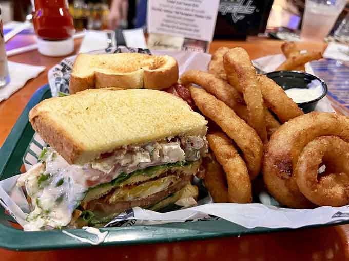 The Mill Creek Club sandwich stacked high with crab salad, proving that not everything requires a mallet here.
