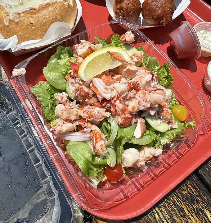 Fresh lobster meat piled on crisp greens proves that not everything needs breading to be absolutely spectacular at the dock.