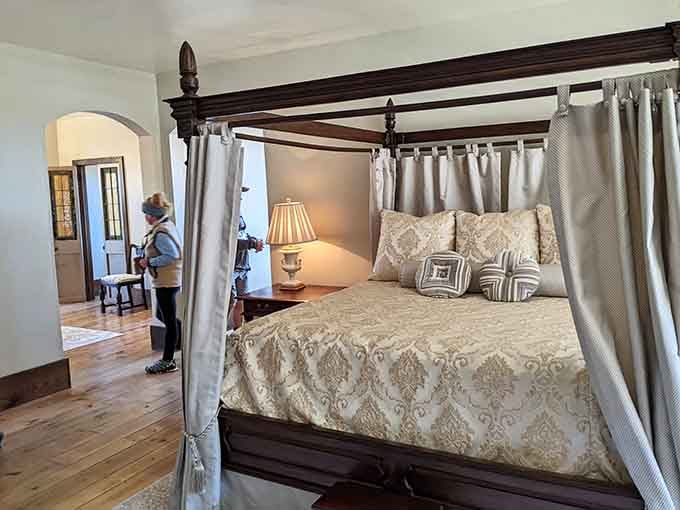That four-poster bed looks like it could host royalty or just really tired travelers equally well.