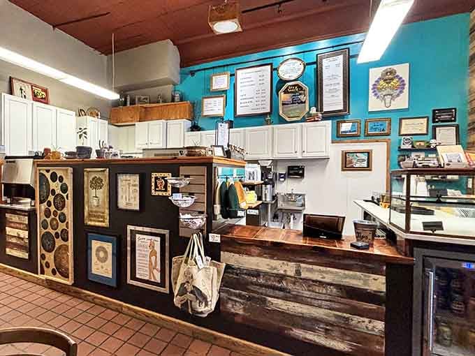 The counter area blends rustic charm with serious coffee equipment, where magic happens one espresso at a time.