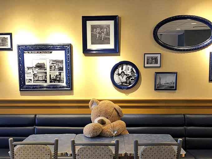 Even the teddy bear knows this booth offers the best seat in the house for people-watching and plate-cleaning.